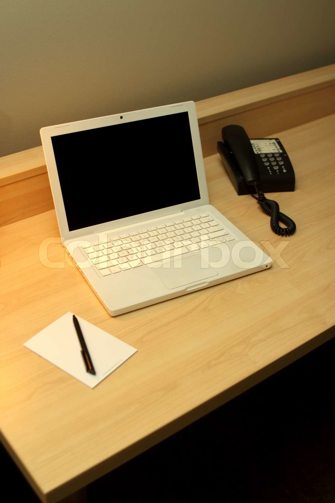 An office desk with office items in a work place scene | Stock image ...