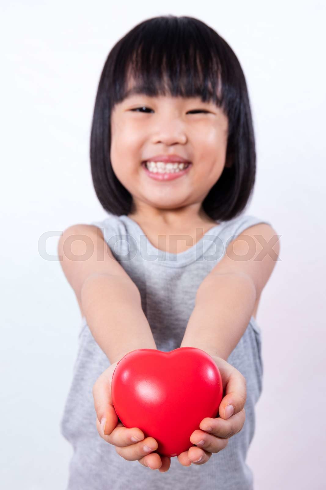 Asian Little Chinese Girl Holding Red Heart | Stock image | Colourbox