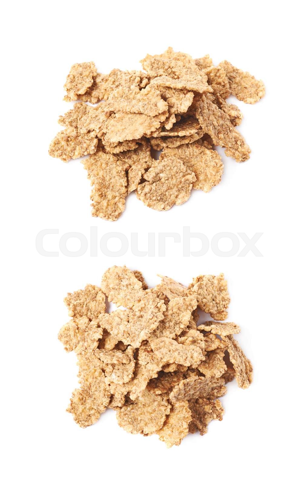 Pile of wholegrain cereal flakes isolated | Stock image | Colourbox