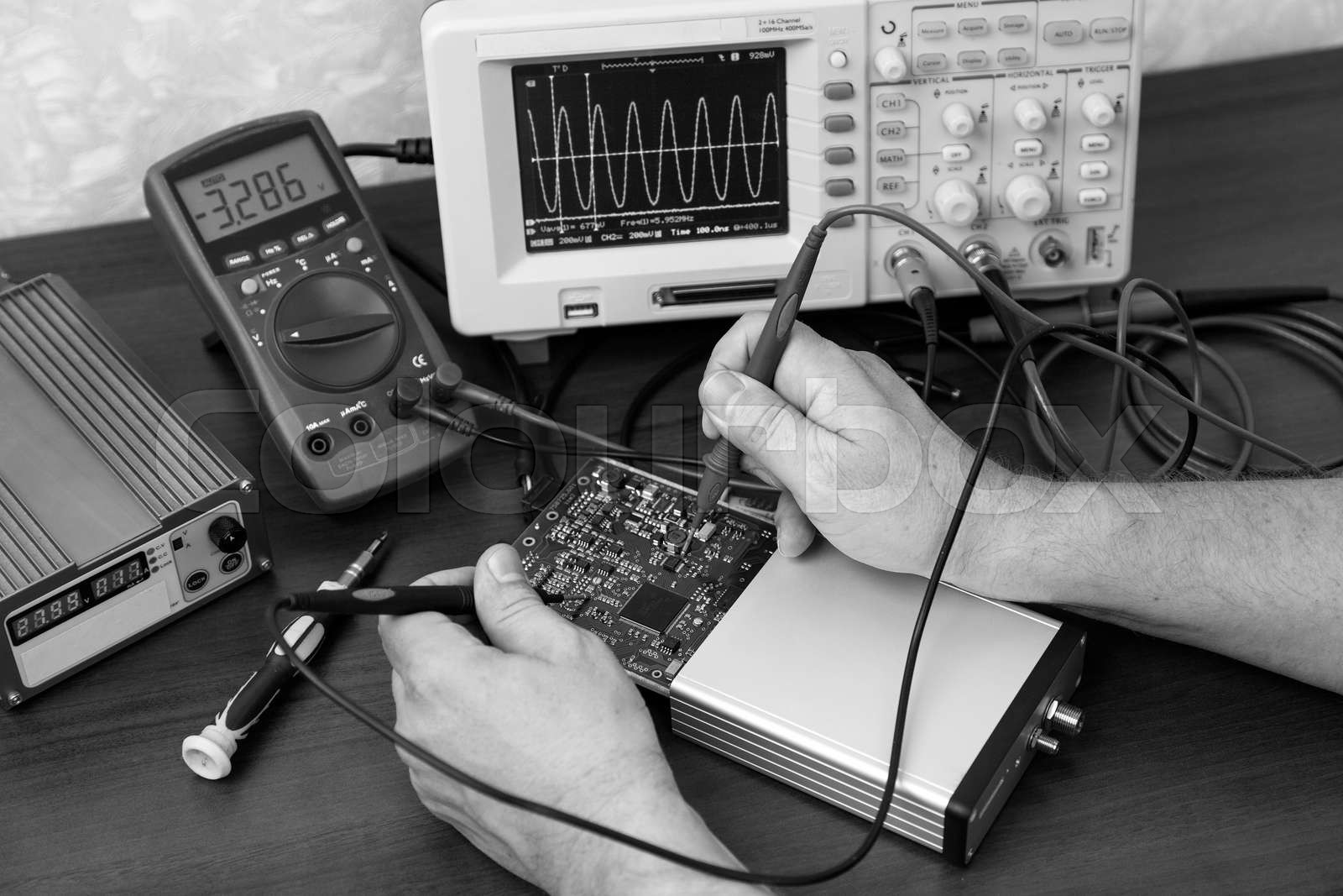 Engineer's hands holding probes | Stock image | Colourbox