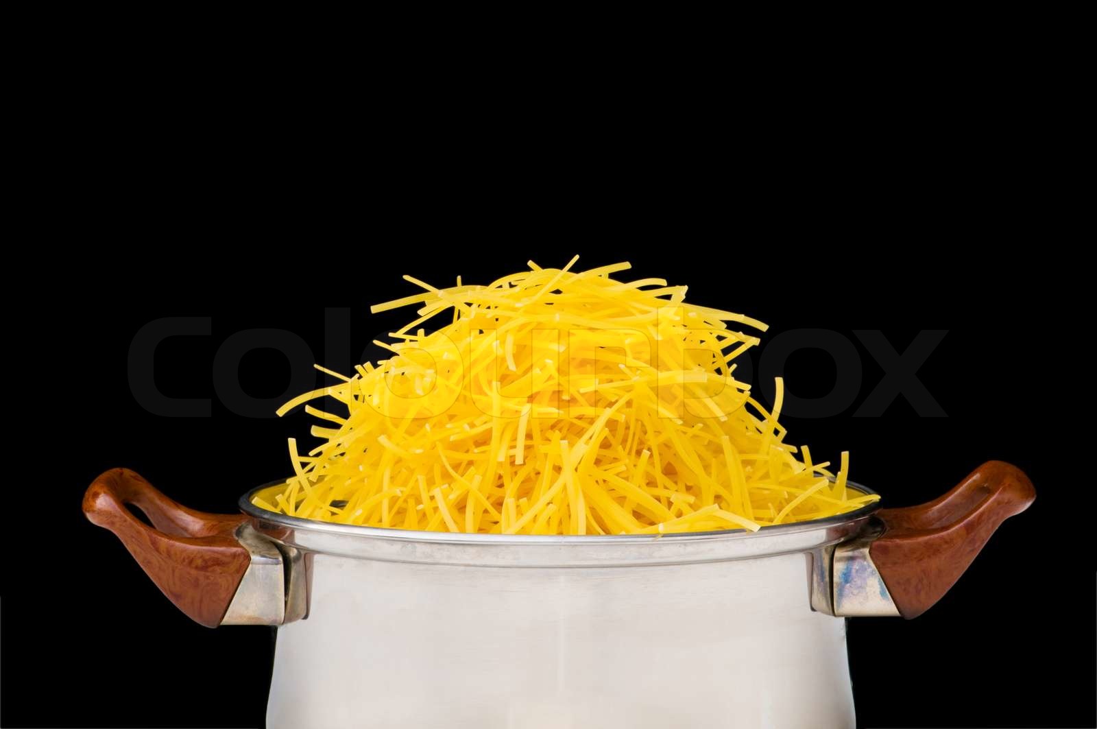 Spaghetti pot isolated on the black background | Stock image | Colourbox