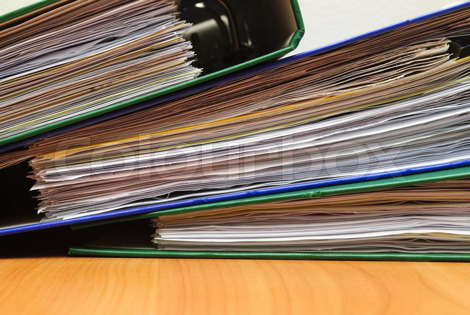 Stack of documents in folders on office desktop close-up. Shallow deep ...