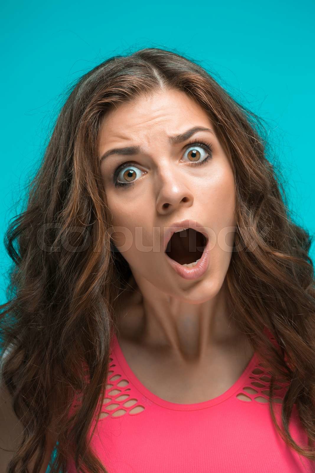 Portrait of young woman with shocked facial expression | Stock image ...