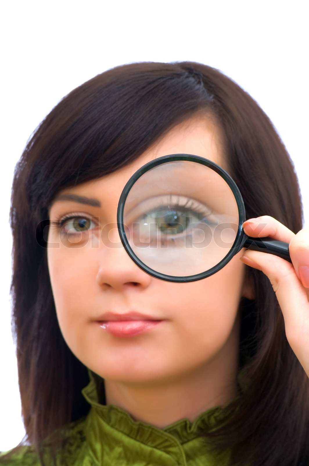 Girl's eye magnified through magnified glass on white | Stock image ...