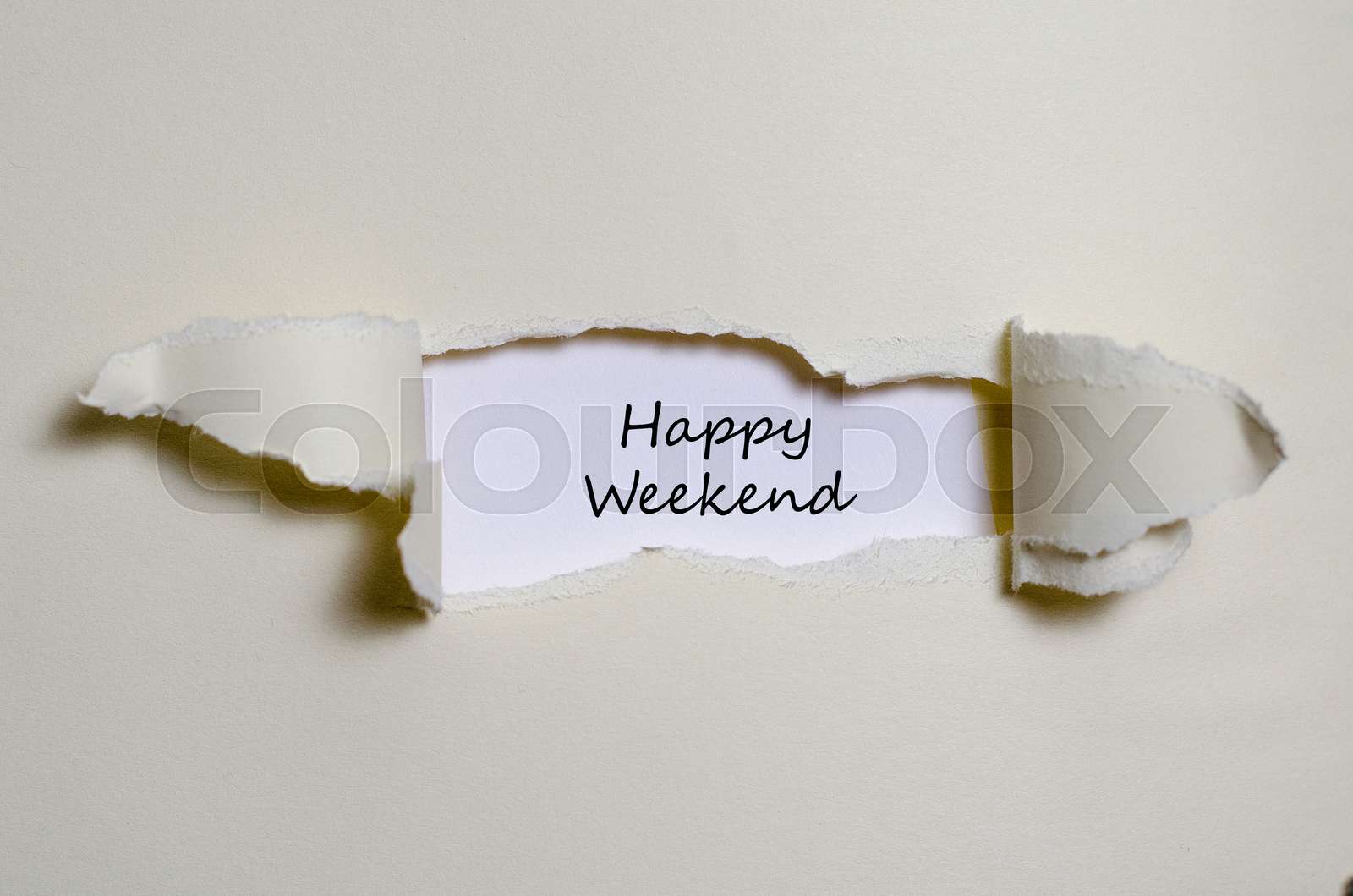 The words happy weekend appearing behind torn paper | Stock image ...