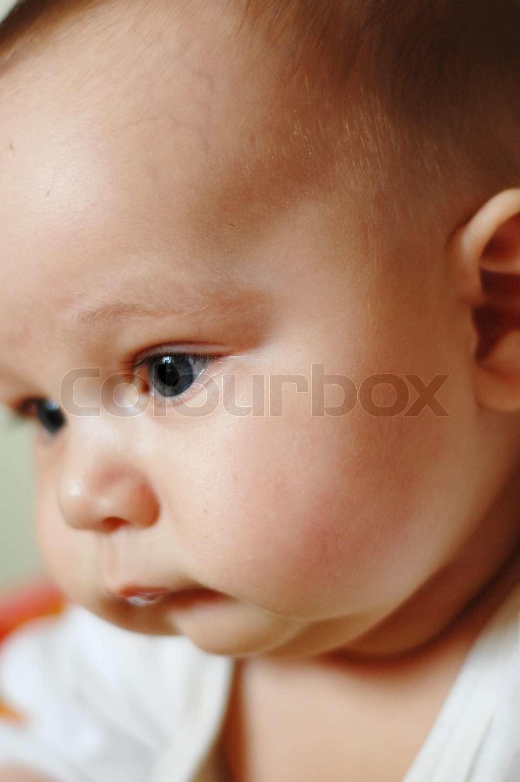 Close-up of a small baby's plump face | Stock image | Colourbox