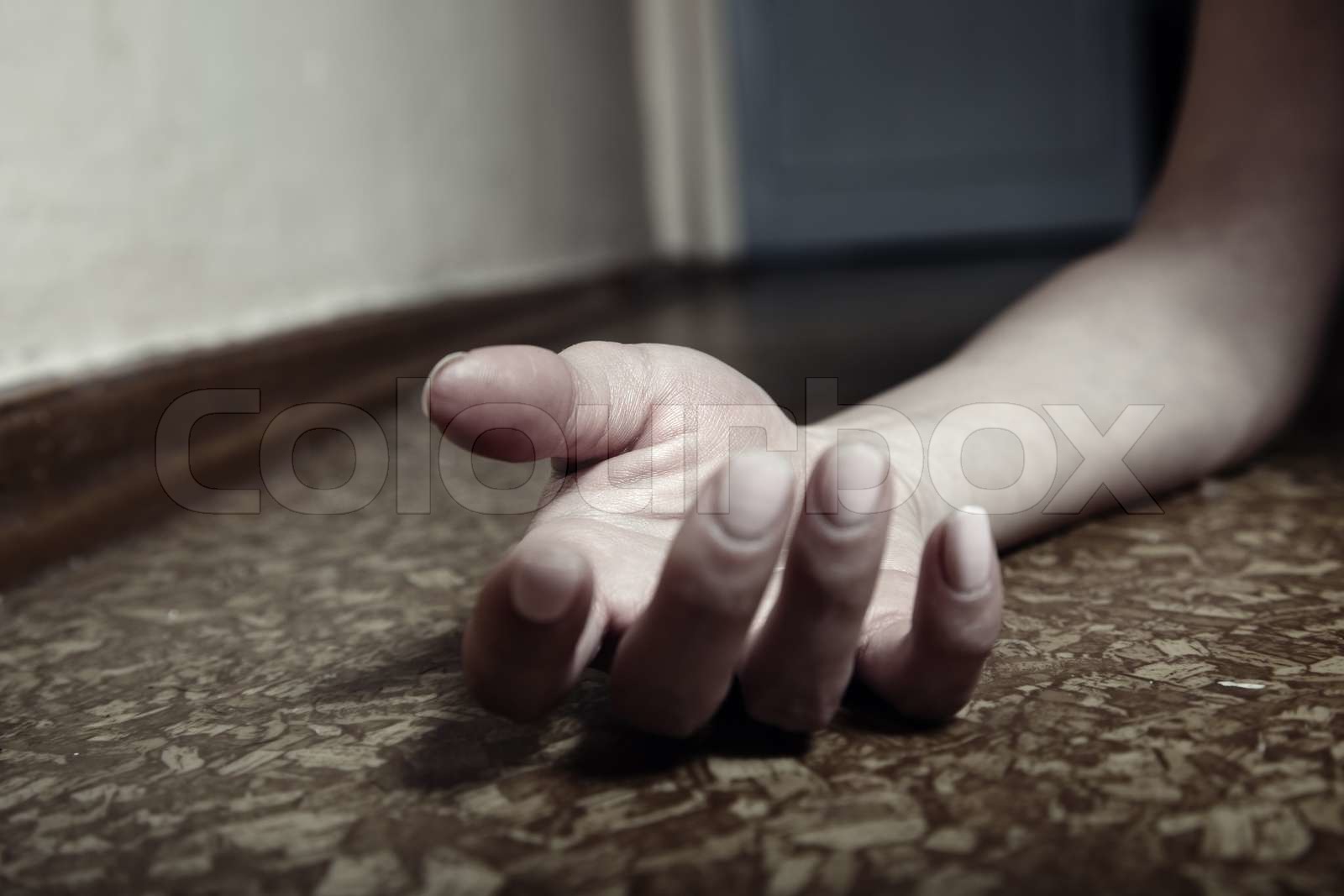 Close-up photo of the human hand laying on the floor | Stock image ...