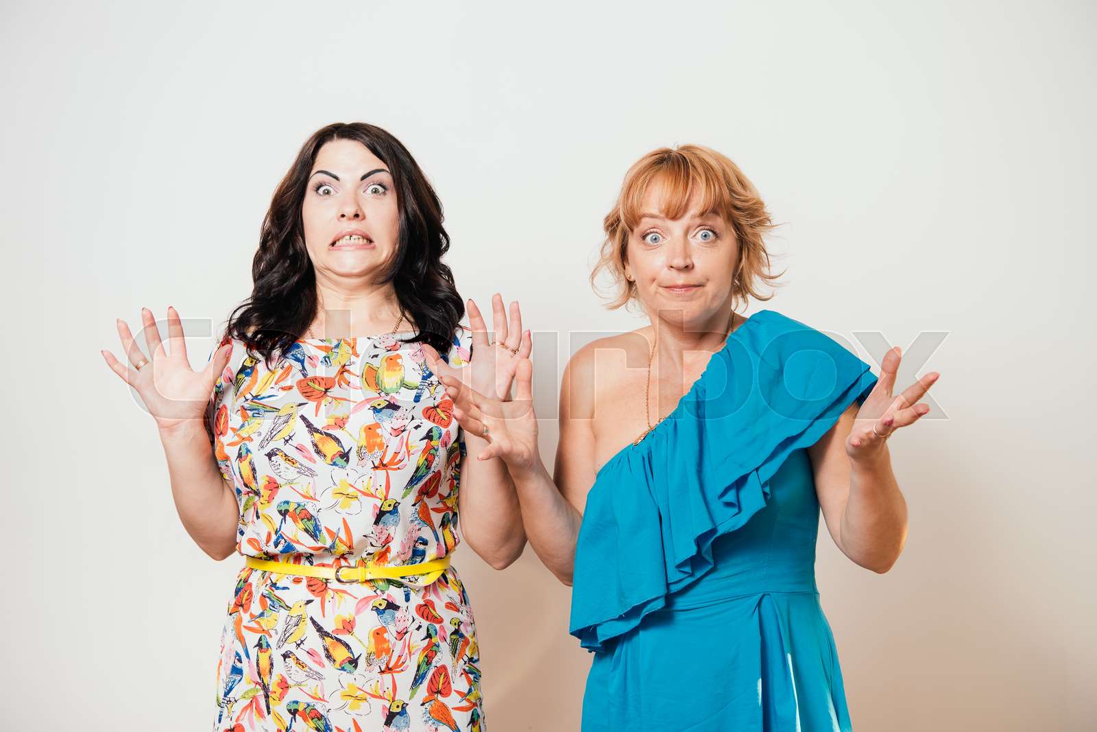 Two attractive women surprised astonished in full disbelief | Stock ...