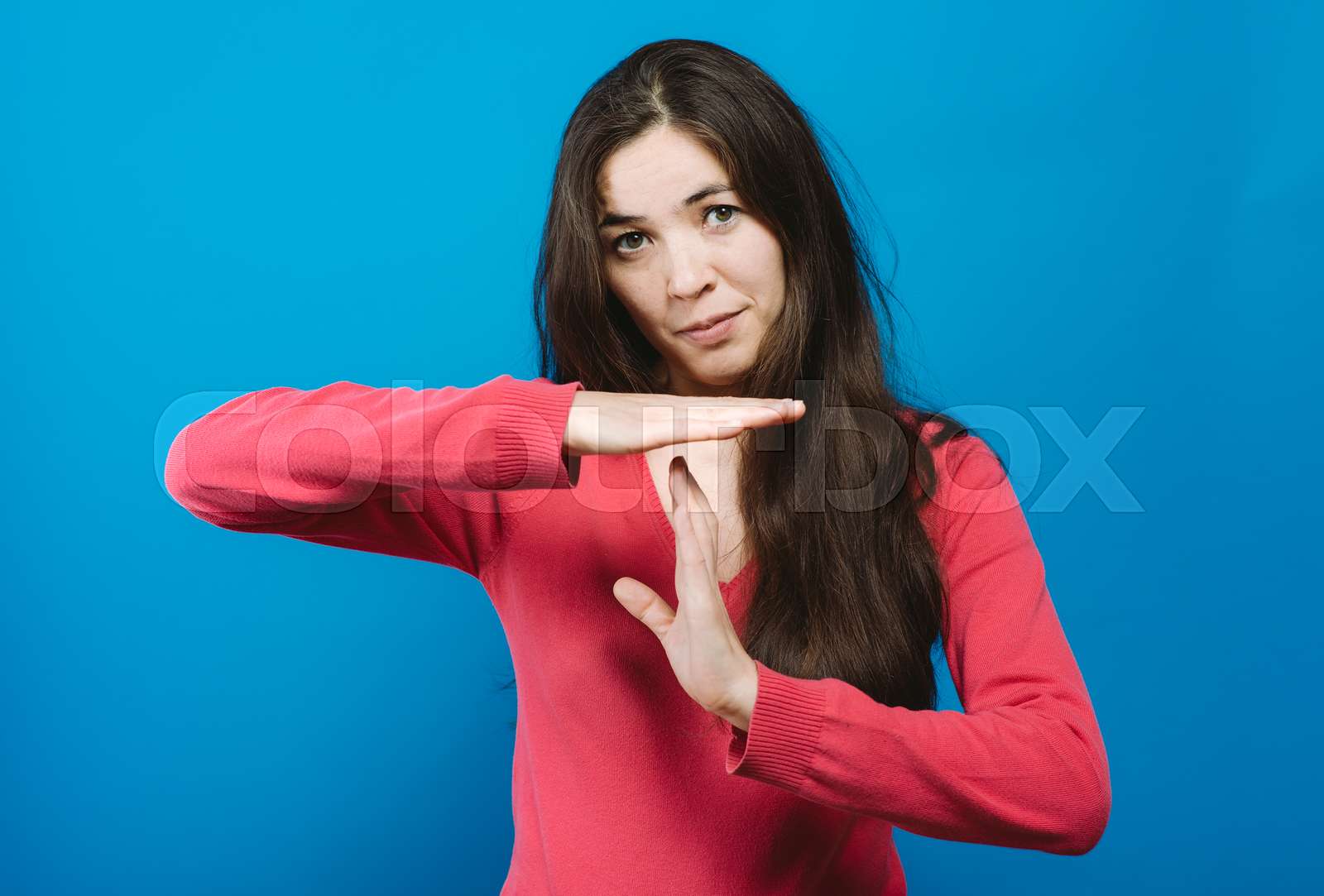 Girl shows a timeout | Stock image | Colourbox