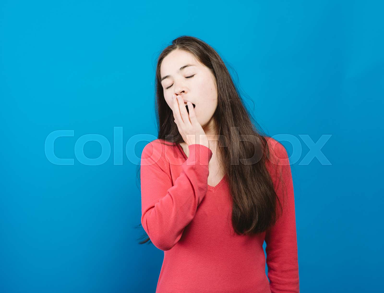 Yawns. Female | Stock image | Colourbox