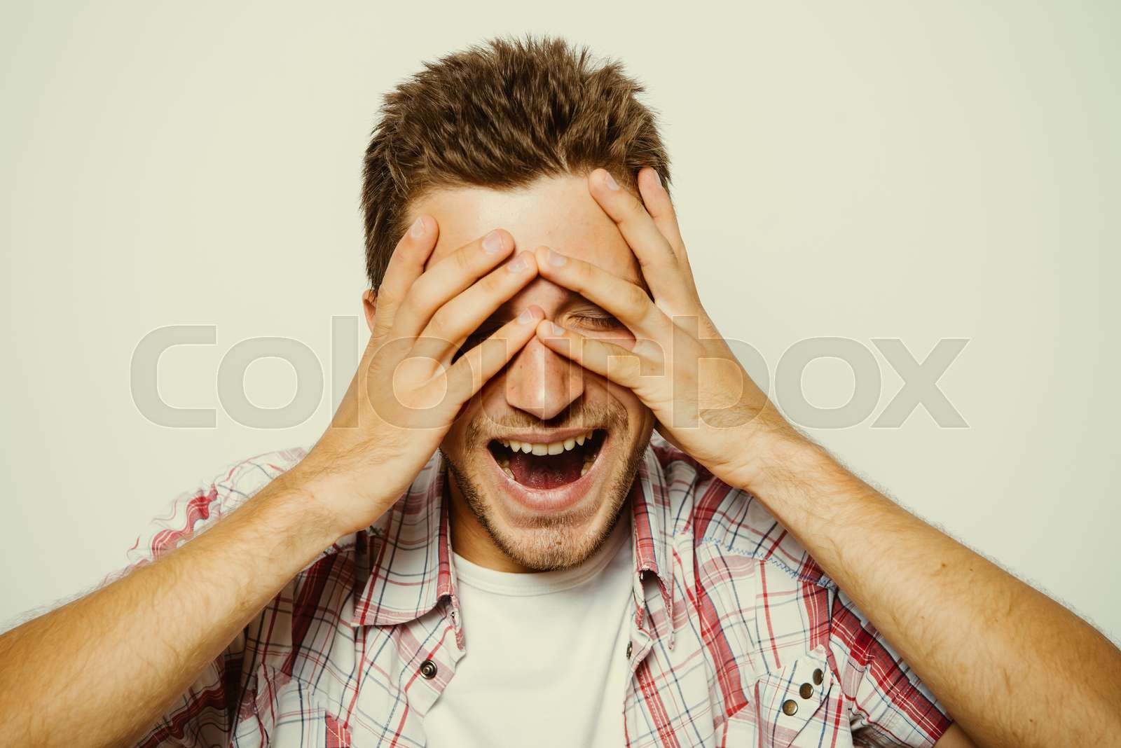 man covered his face with his hands | Stock image | Colourbox