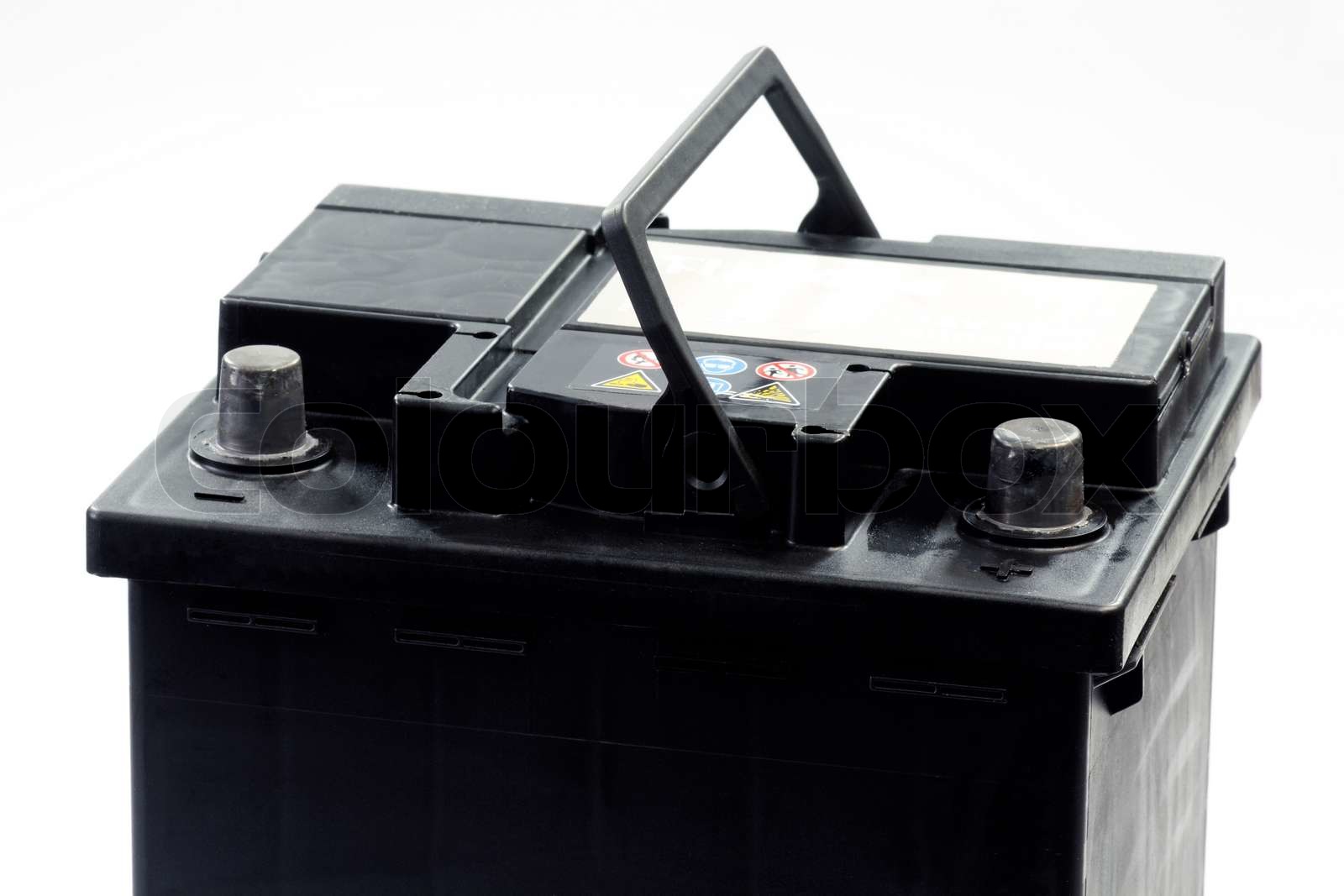 12 volt car battery with electrical leads clipped on to the terminals ...