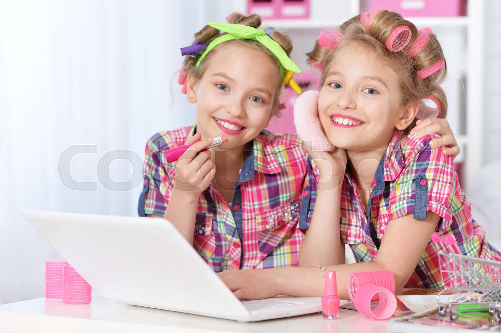 Cute tweenie girls with laptop | Stock image | Colourbox