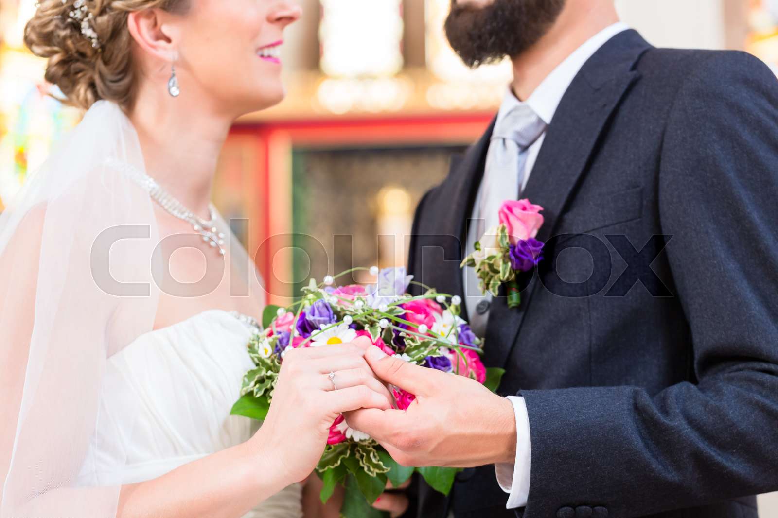 Bridal couple in church having wedding | Stock image | Colourbox