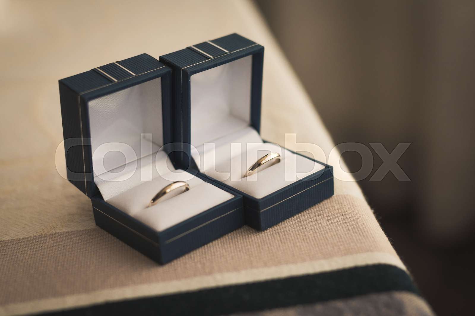 A pair of golden rings in the box | Stock image | Colourbox
