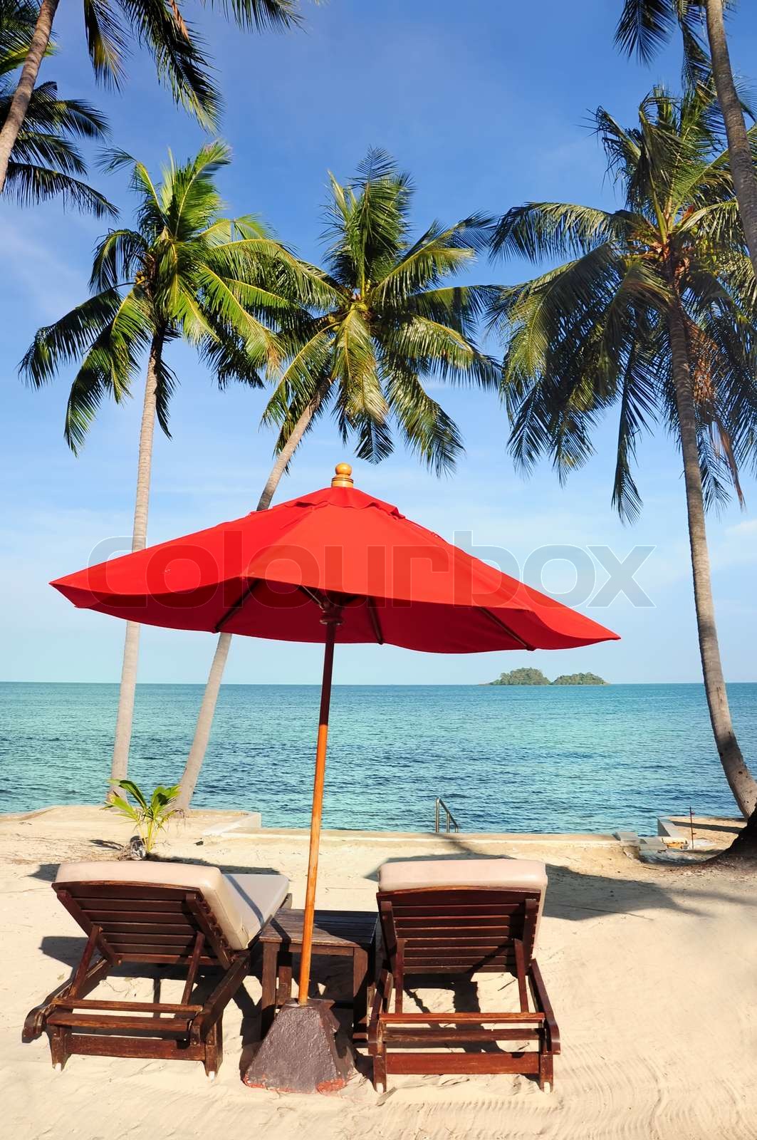 Red umbrella on the tropical beach | Stock image | Colourbox