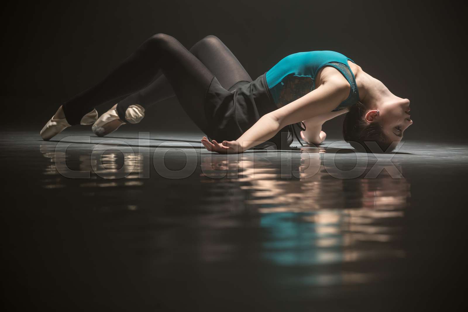 Ballet dancer lying on the floor | Stock image | Colourbox