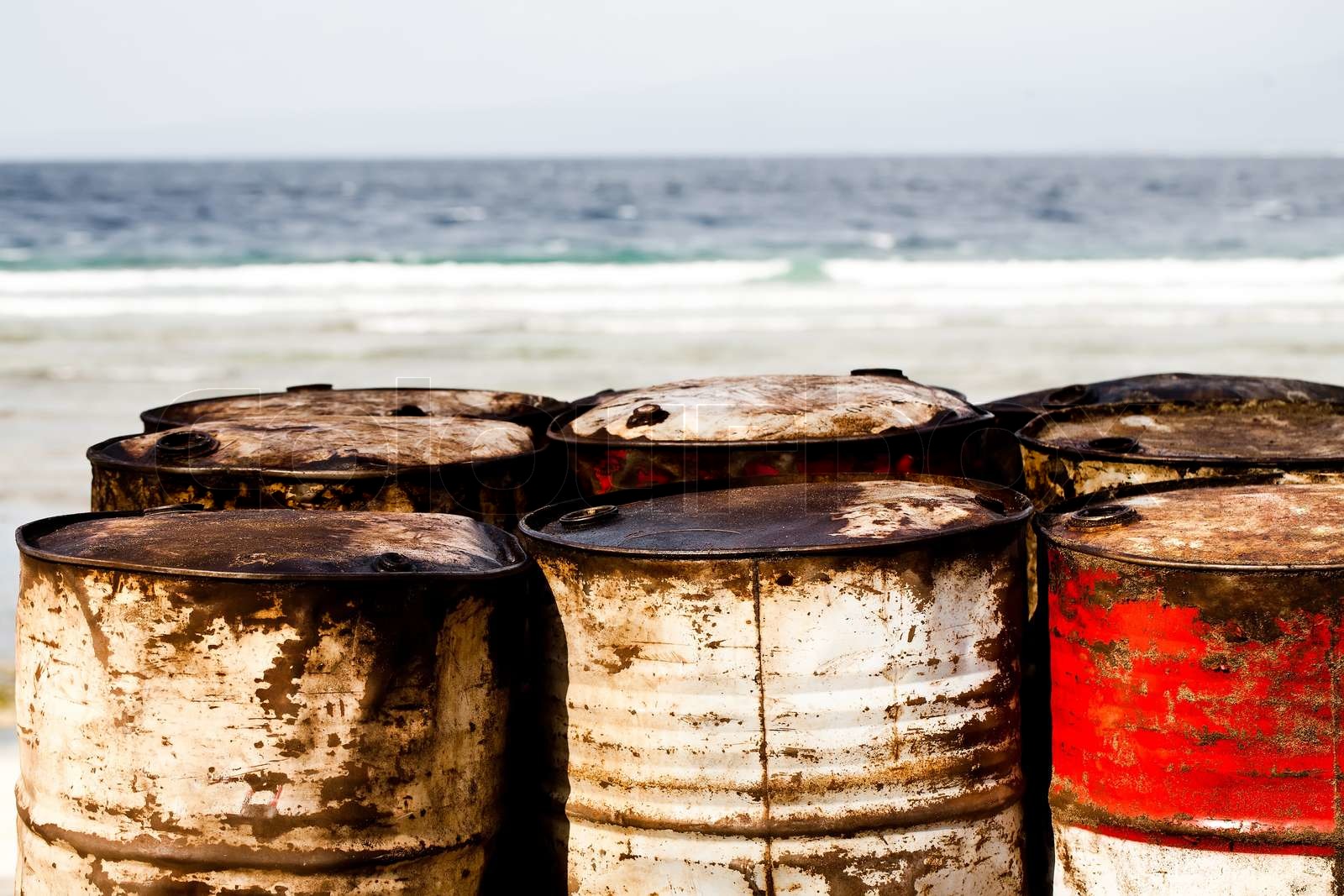 Waste oil drums on the beach | Stock image | Colourbox