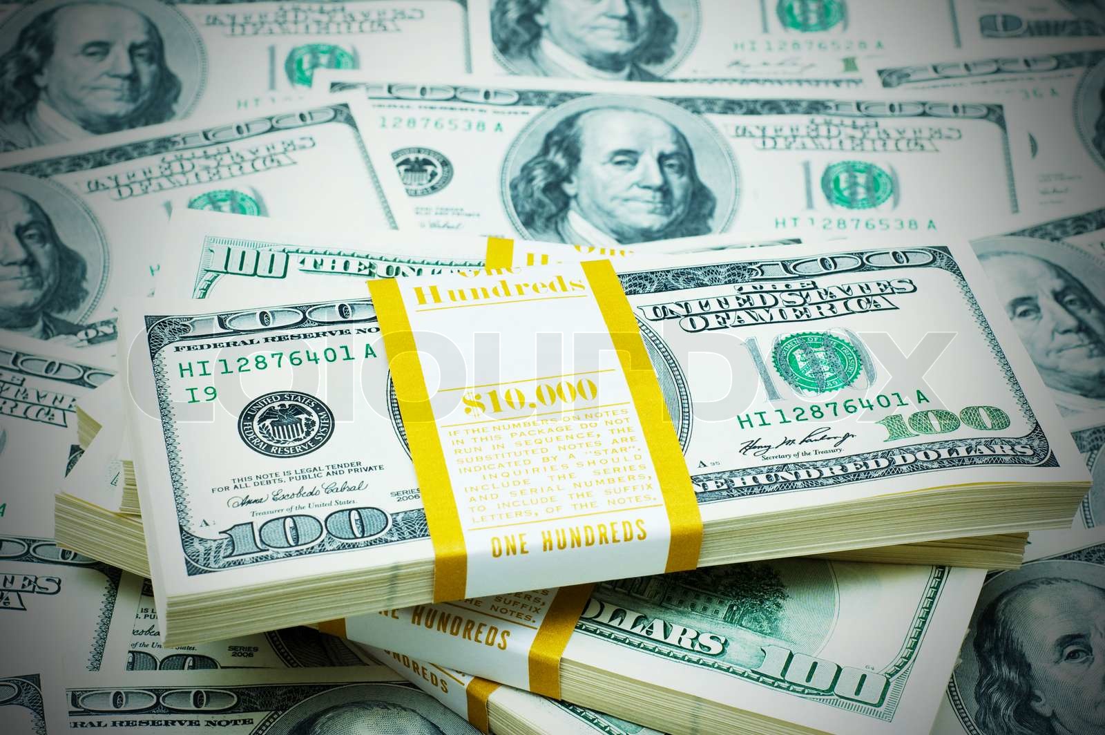 Stak af dollars på penge baggrund | Stock foto | Colourbox