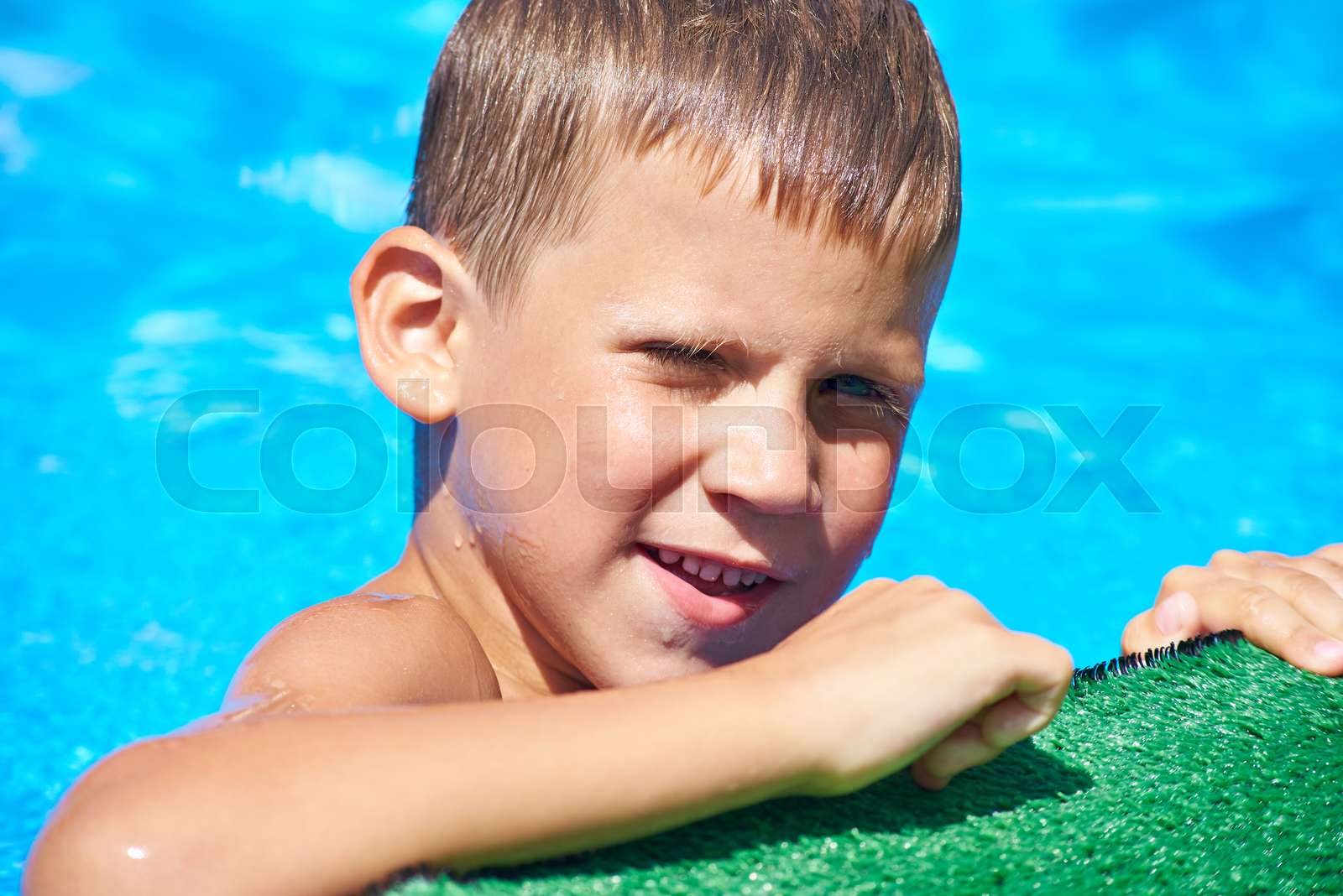 Little boy in pool | Stock image | Colourbox