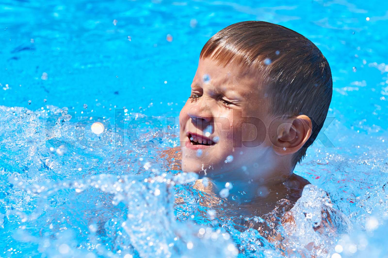 Little boy swimming in pool | Stock image | Colourbox