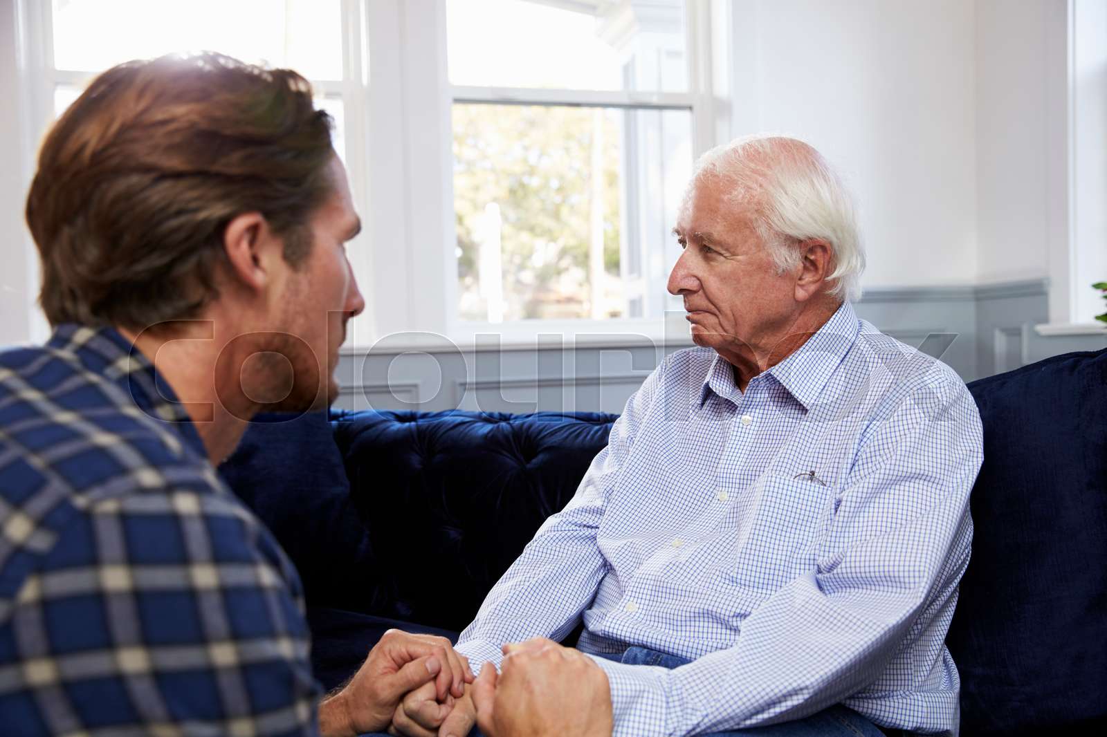Adult Son Talking To Depressed Father At Home | Stock image | Colourbox