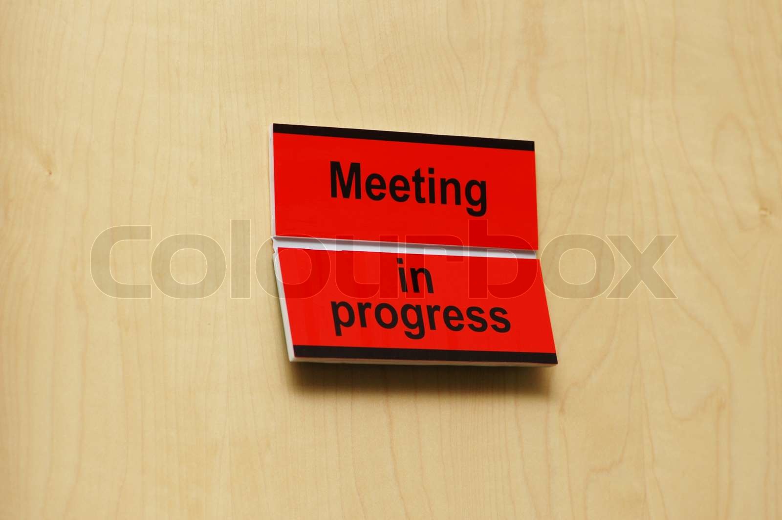 Meeting room with label "Meeting in progress" | Stock image | Colourbox