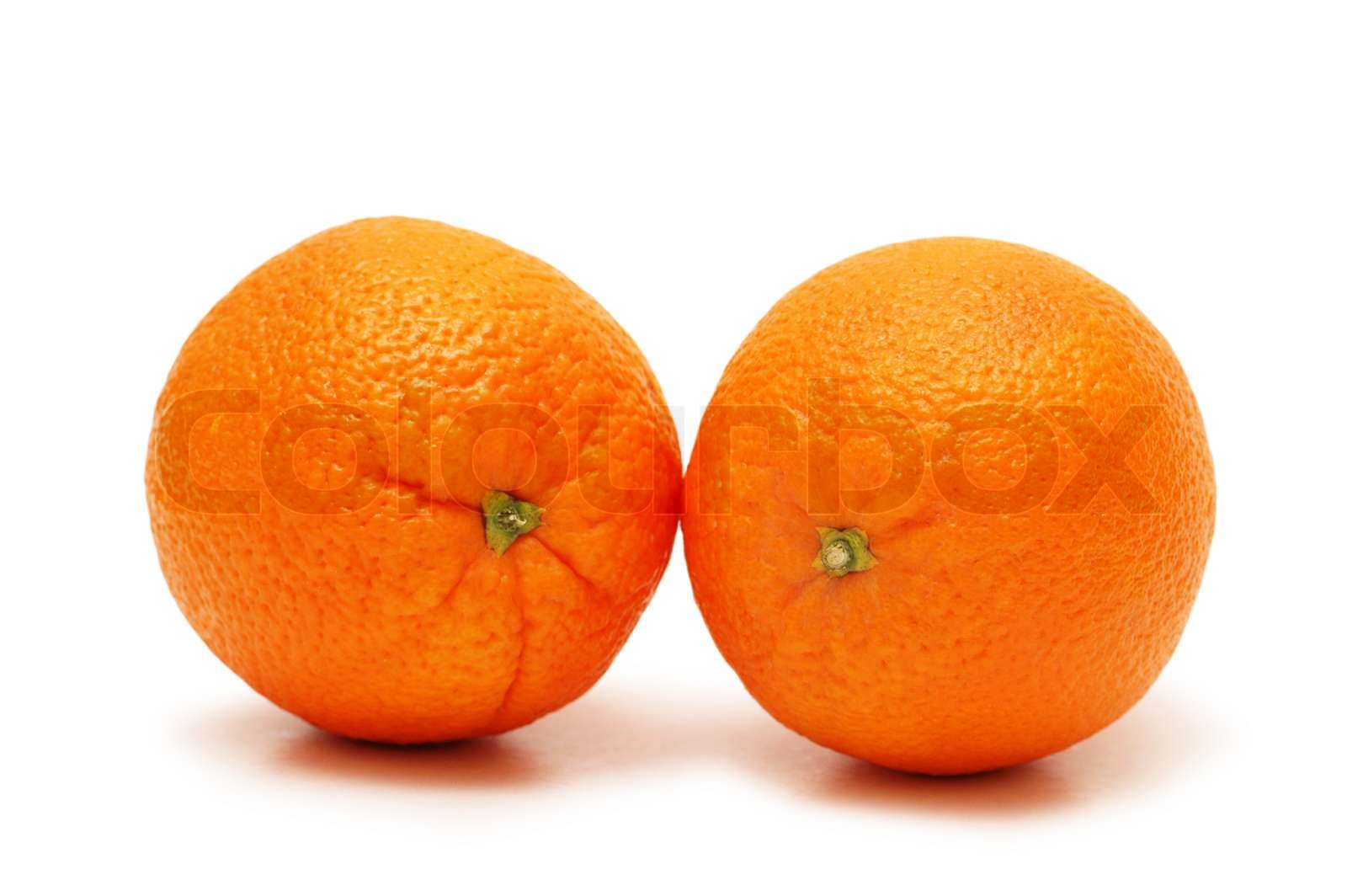 To appelsiner isoleret på den hvide baggrund | Stock foto | Colourbox