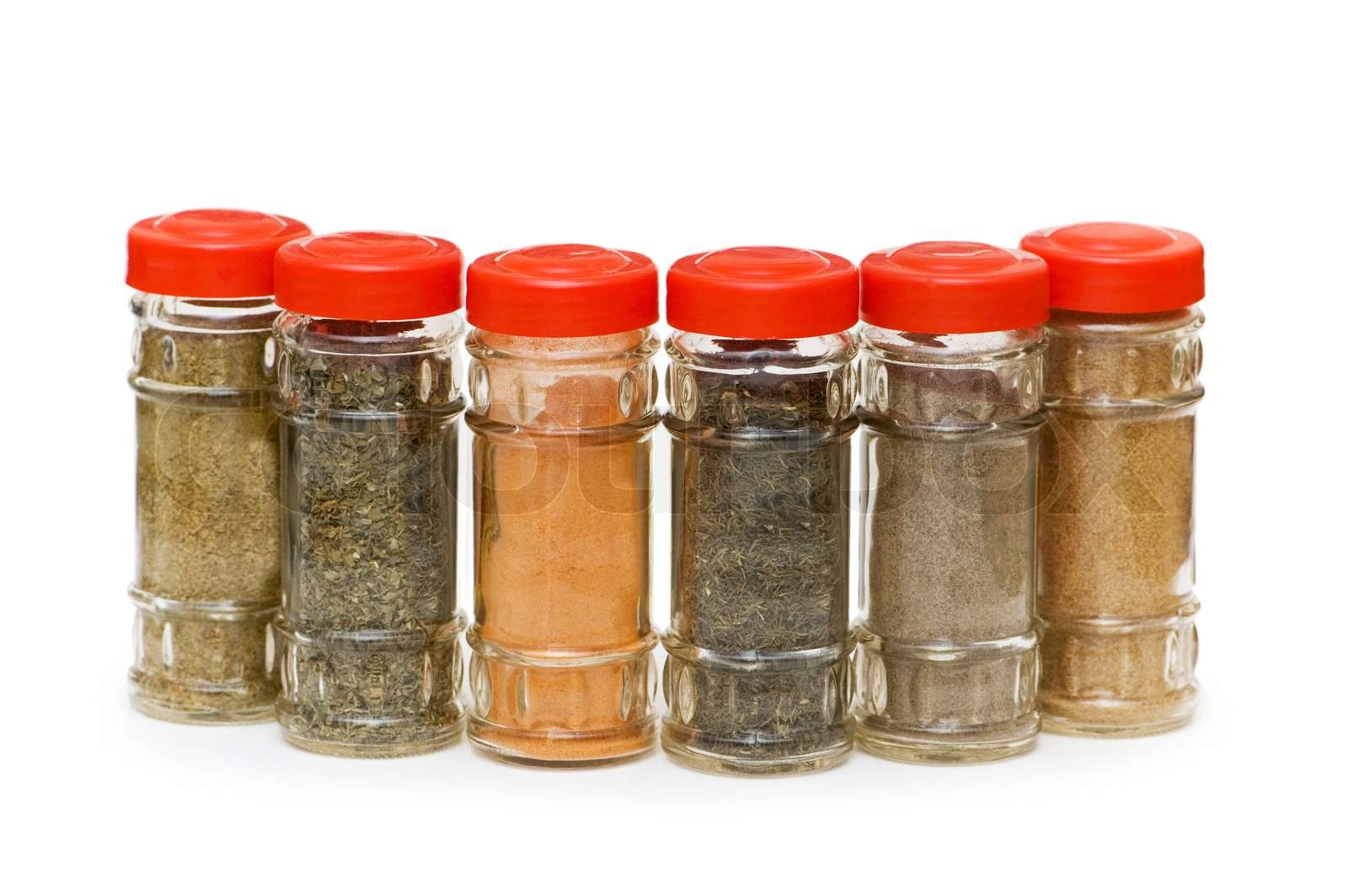 Various spices in bottles isolated on white | Stock image | Colourbox