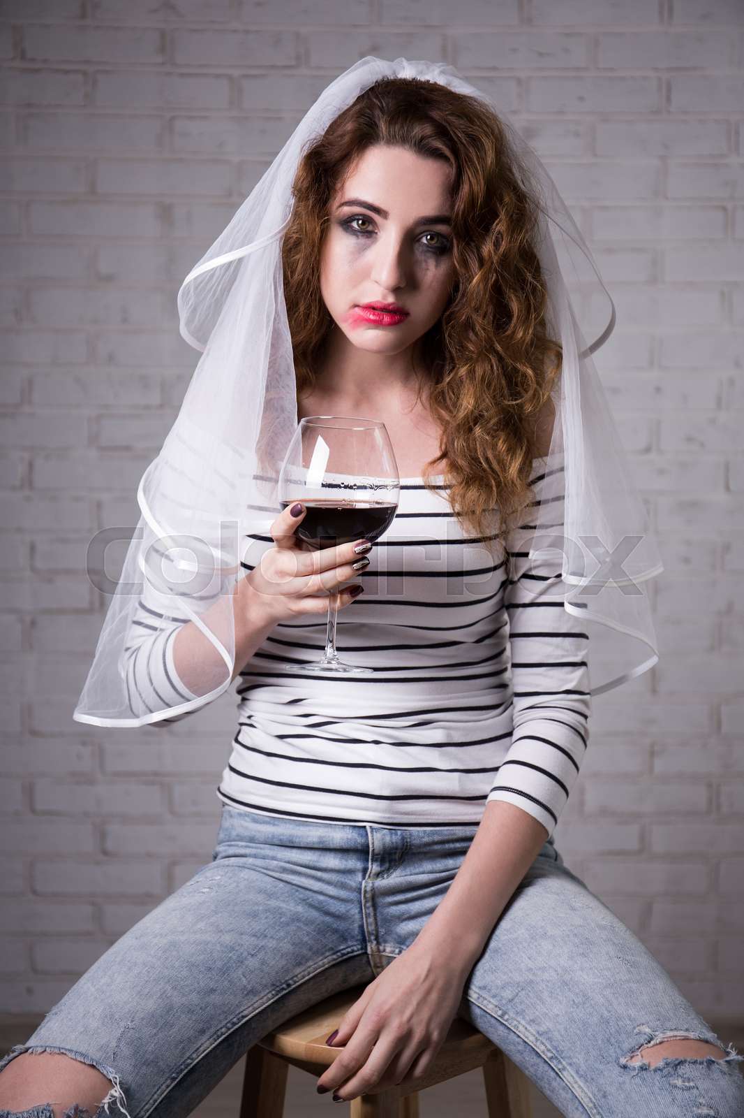 sad bride crying and drinking wine | Stock image | Colourbox