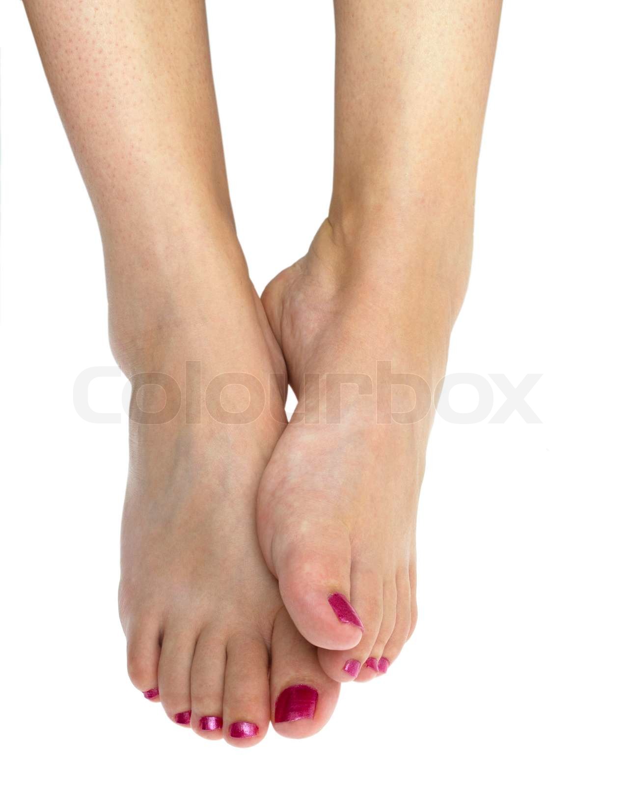 Woman foot with pink nail polish on white | Stock image | Colourbox