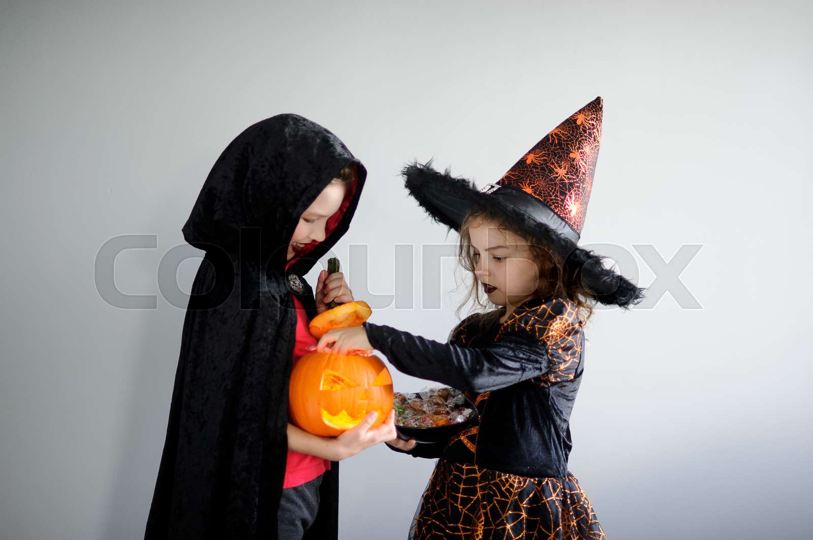 Trick or Treat. Boy and girl in suits for Halloween. | Stock image ...