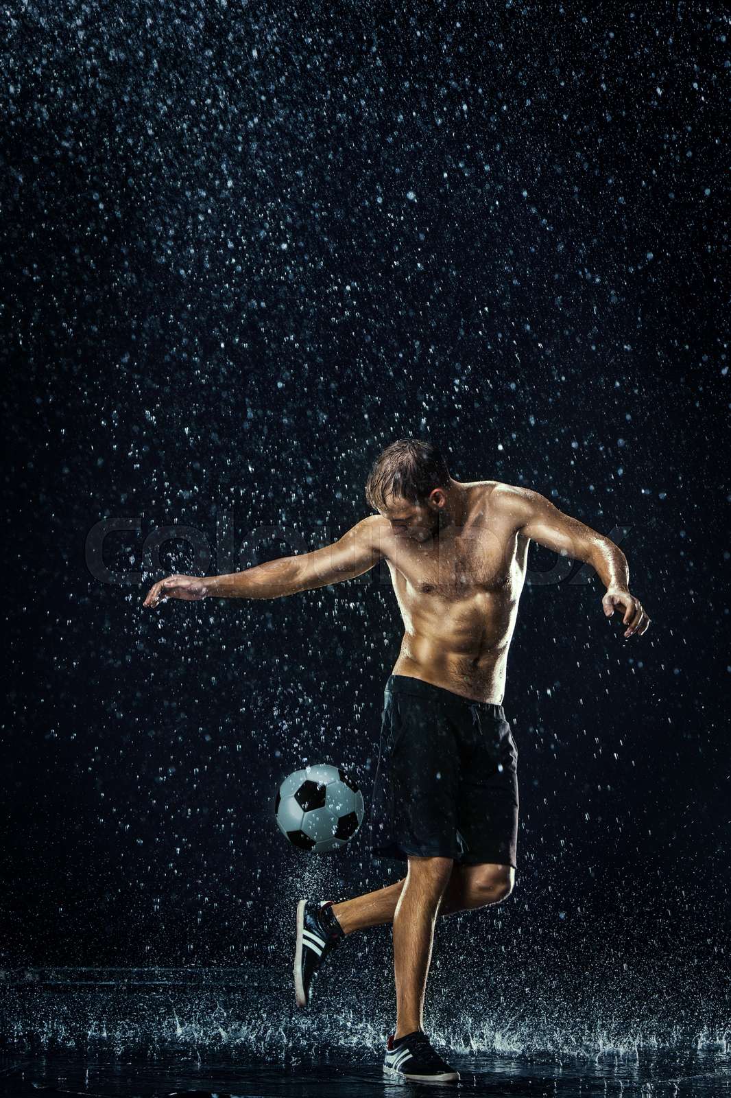 Water drops around football player under water | Stock image | Colourbox