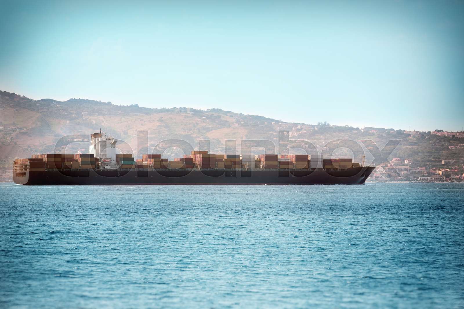 Large container ship, which sails on the open sea | Stock image | Colourbox