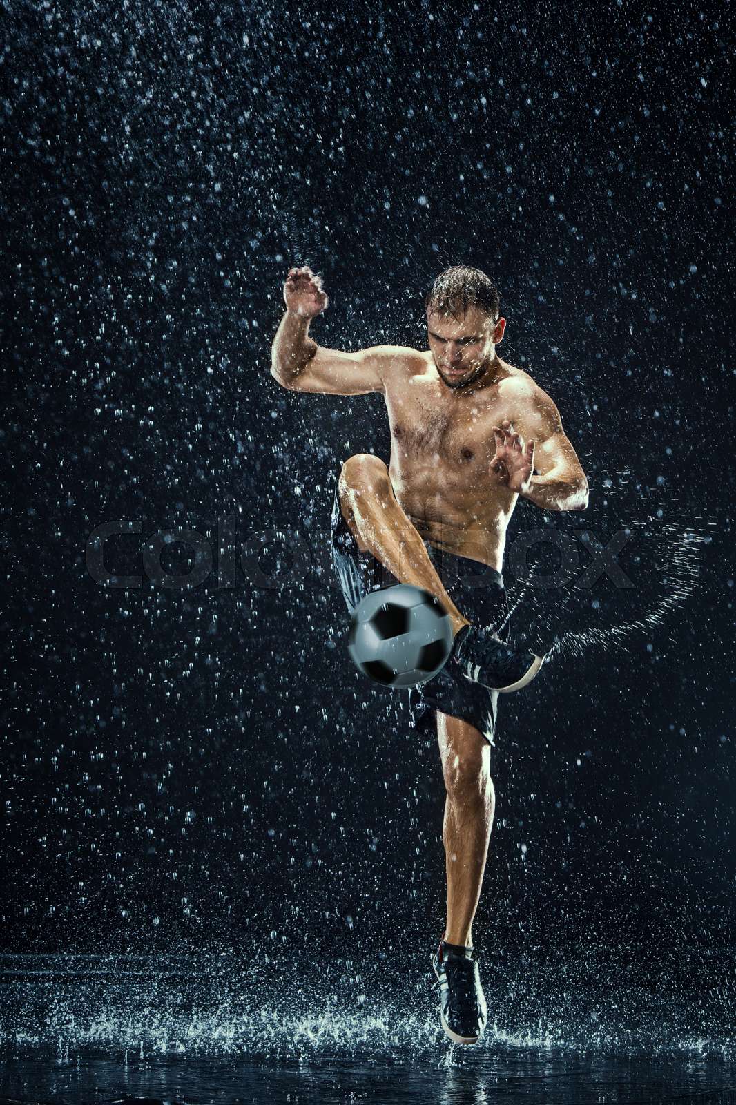 Water drops around football player under water | Stock image | Colourbox