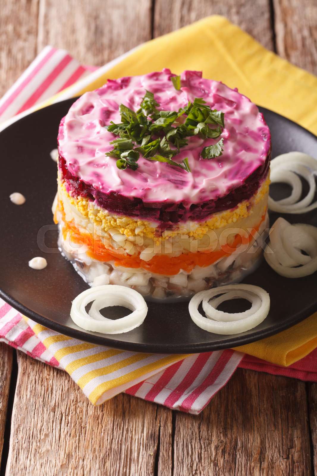 Russian food: Shuba - herring salad with vegetables close-up. vertical ...