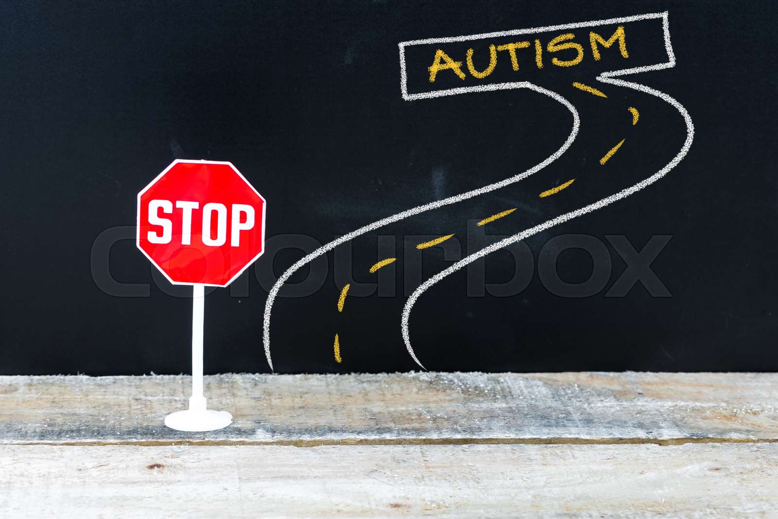 Mini STOP sign on the road to AUTISM | Stock image | Colourbox