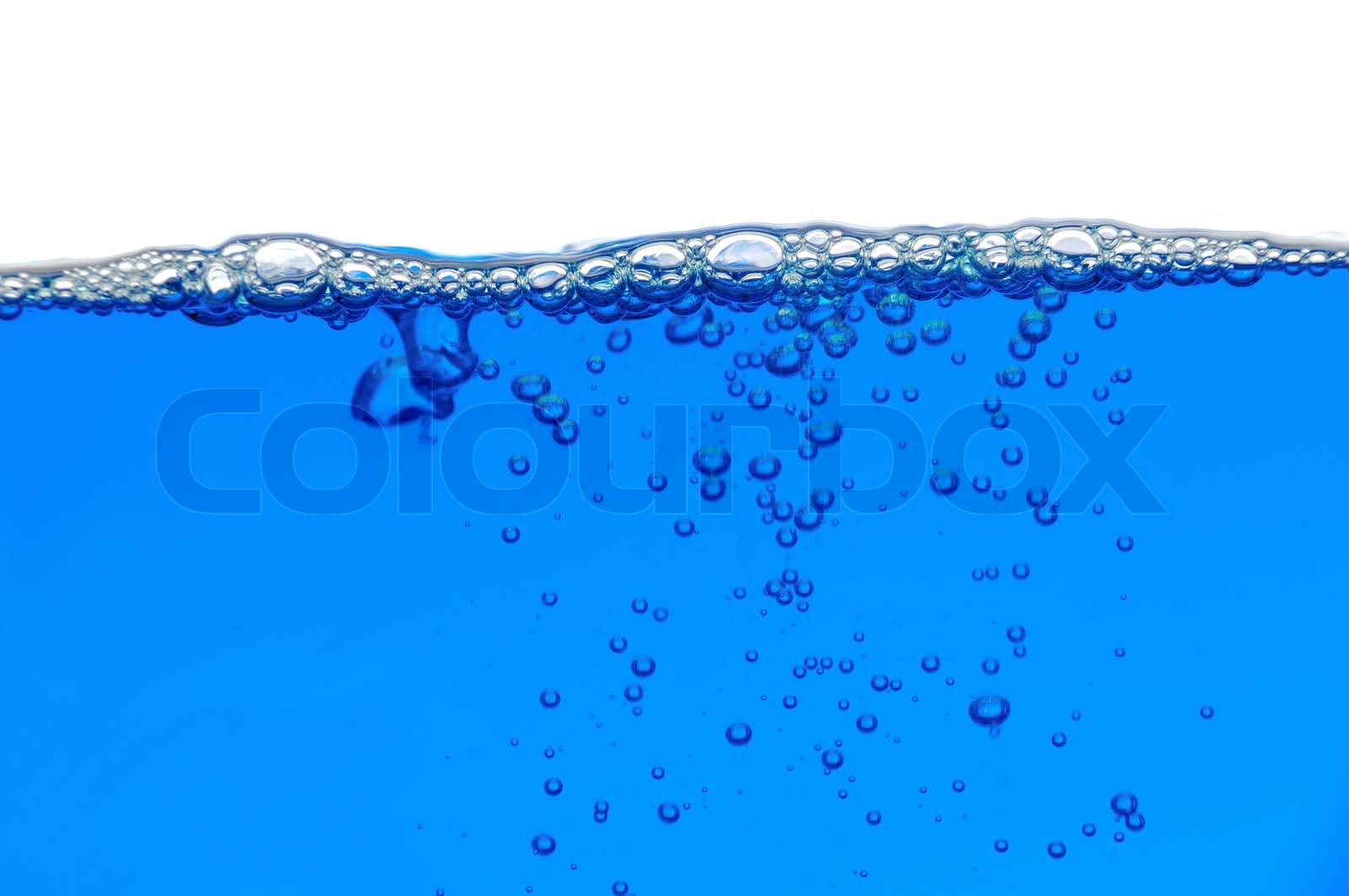 Blue water with air bubbles in the water line and under the water ...