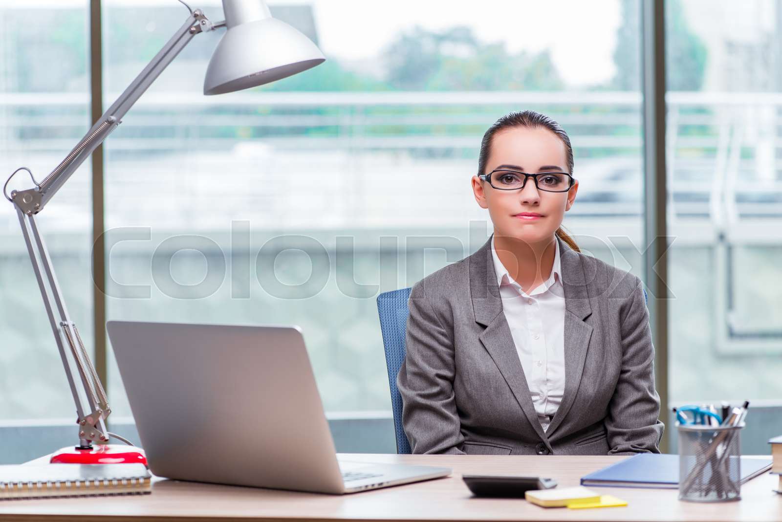 Young assistant working in the office | Stock image | Colourbox