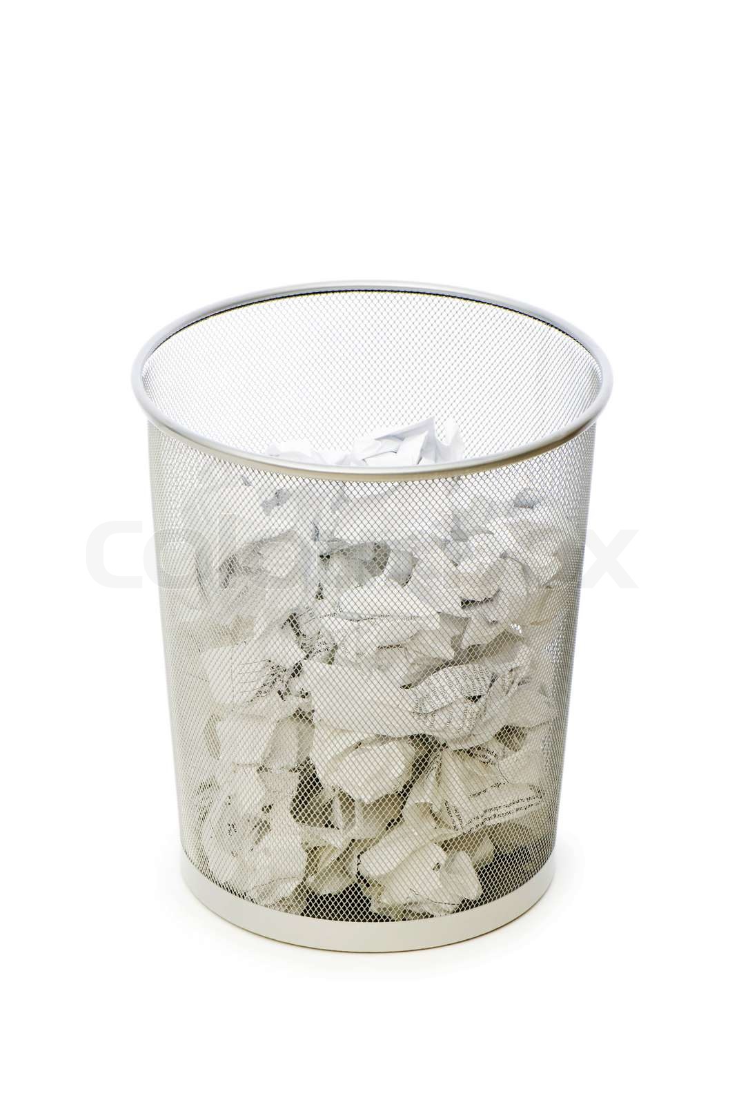 Garbage bin with paper waste isolated on white | Stock image | Colourbox