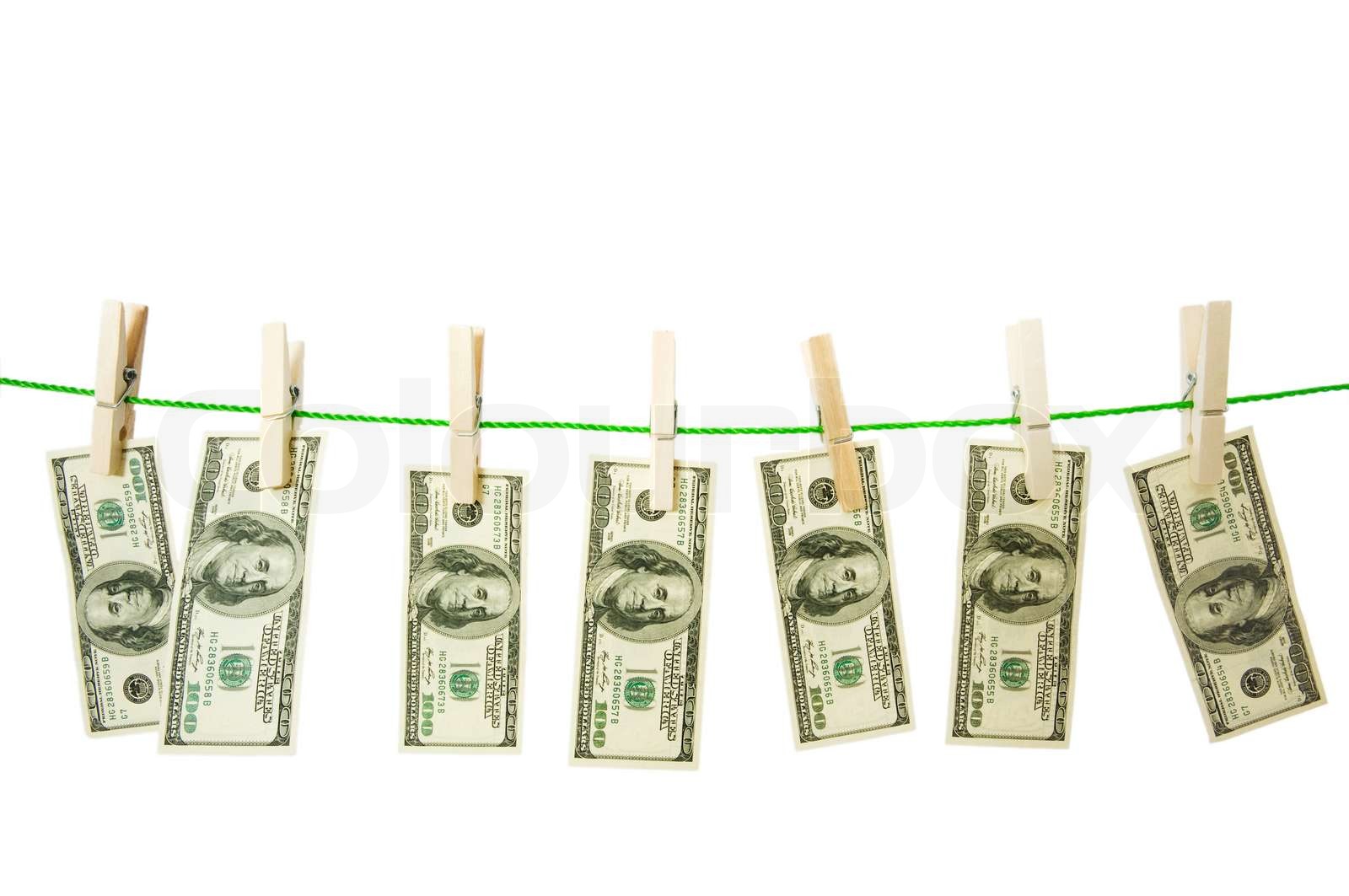 Hvidvaskning af penge koncept med dollars på rebet | Stock foto | Colourbox