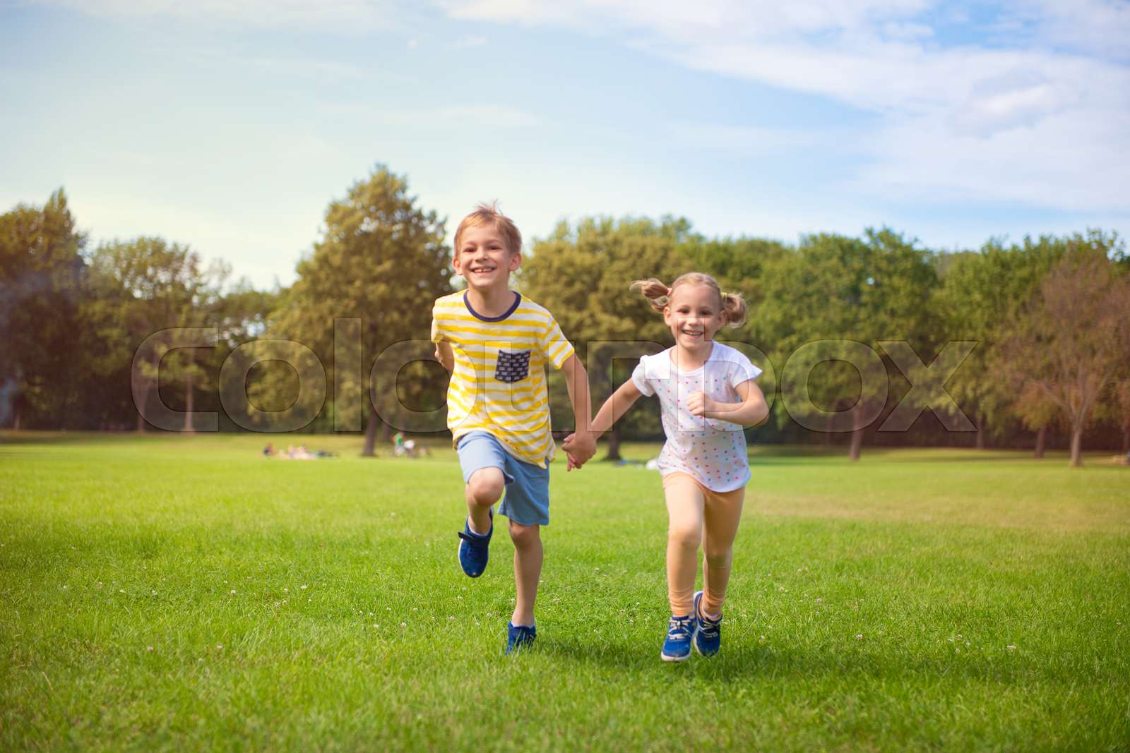 Happy children running in park | Stock image | Colourbox