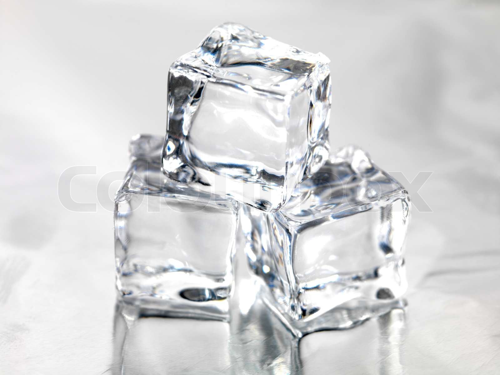 Frozen ice cubes isolated on a kitchen bench | Stock image | Colourbox
