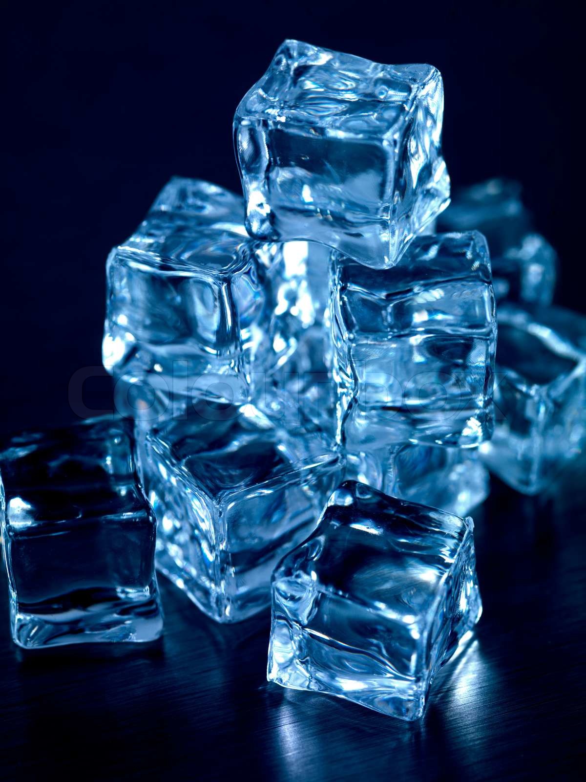 Frozen ice cubes isolated on a kitchen bench | Stock image | Colourbox