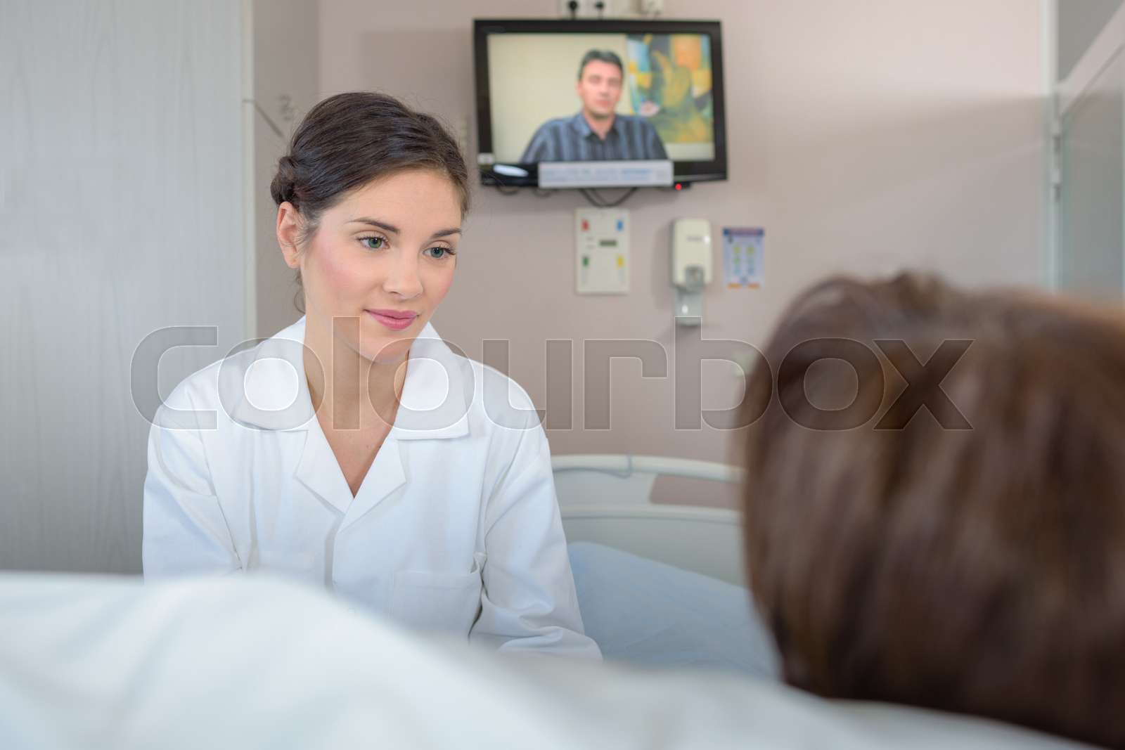 patient watching tv in hospital | Stock image | Colourbox