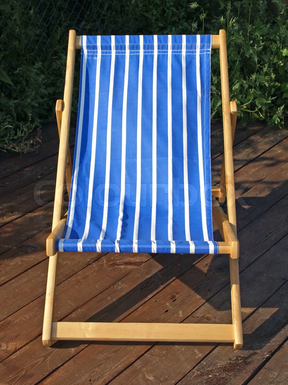 Shaise lounge on a wooden boards. | Stock image | Colourbox