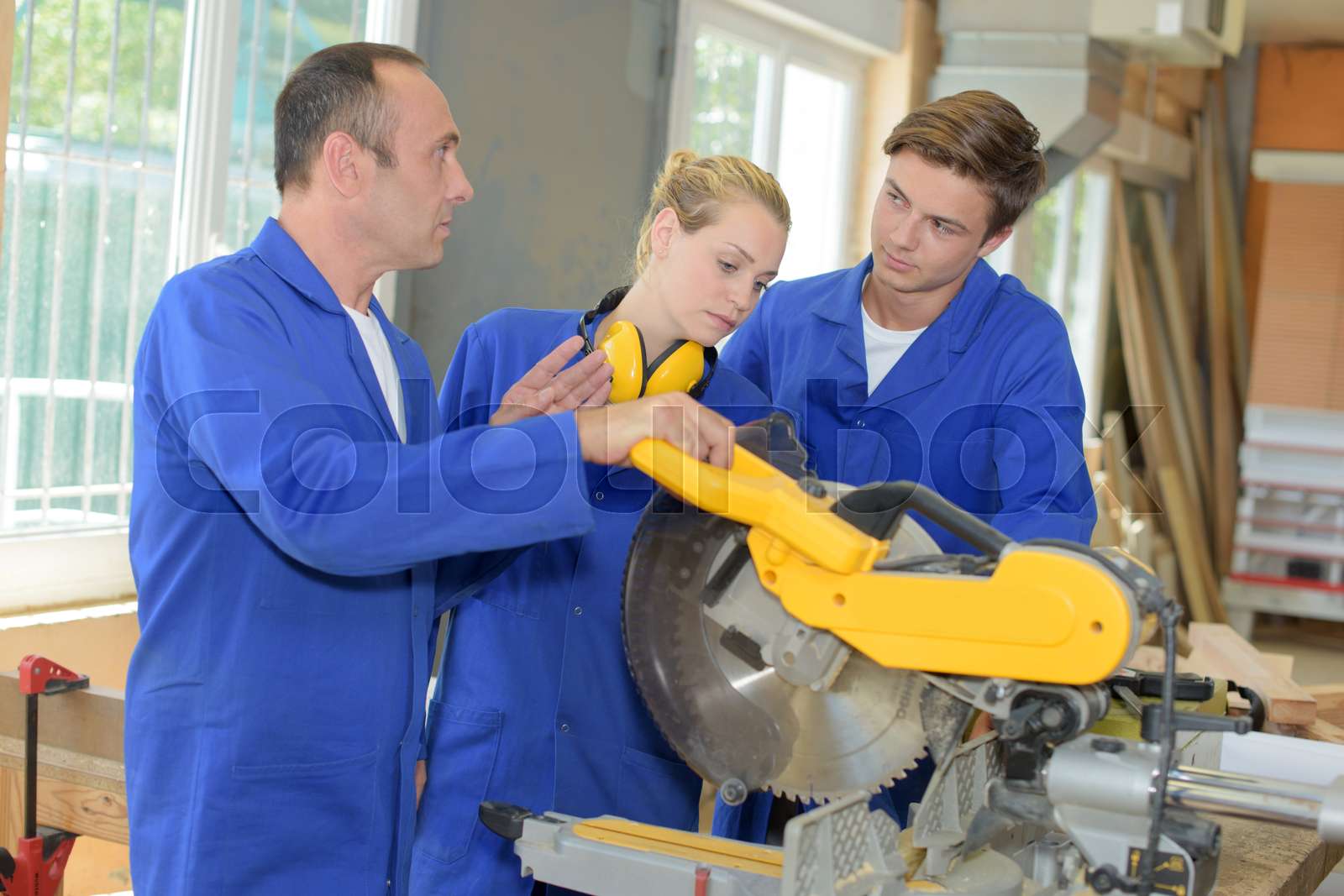 using the drop saw | Stock image | Colourbox