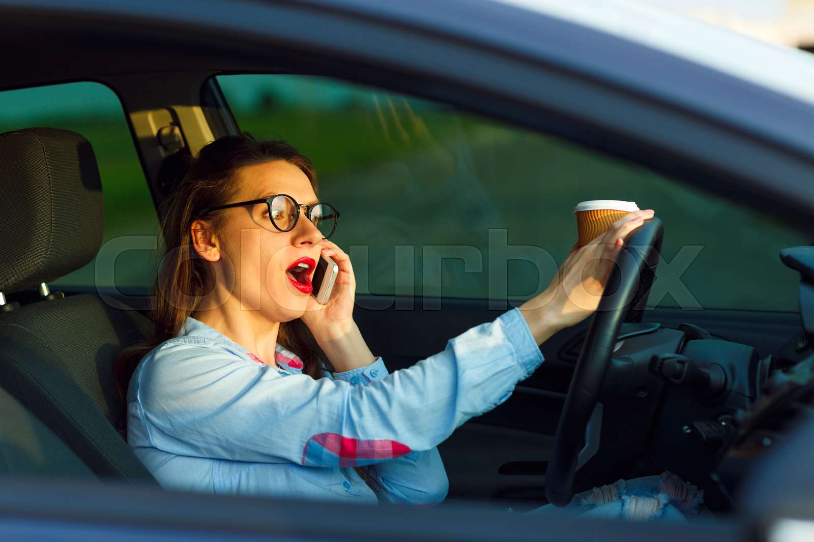 Businesswoman Multitasking While Driving Stock Image Colourbox
