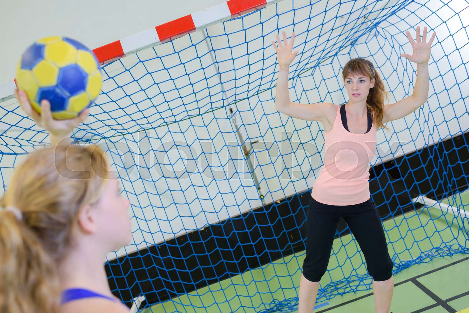 Goal keeper defending handball net | Stock image | Colourbox