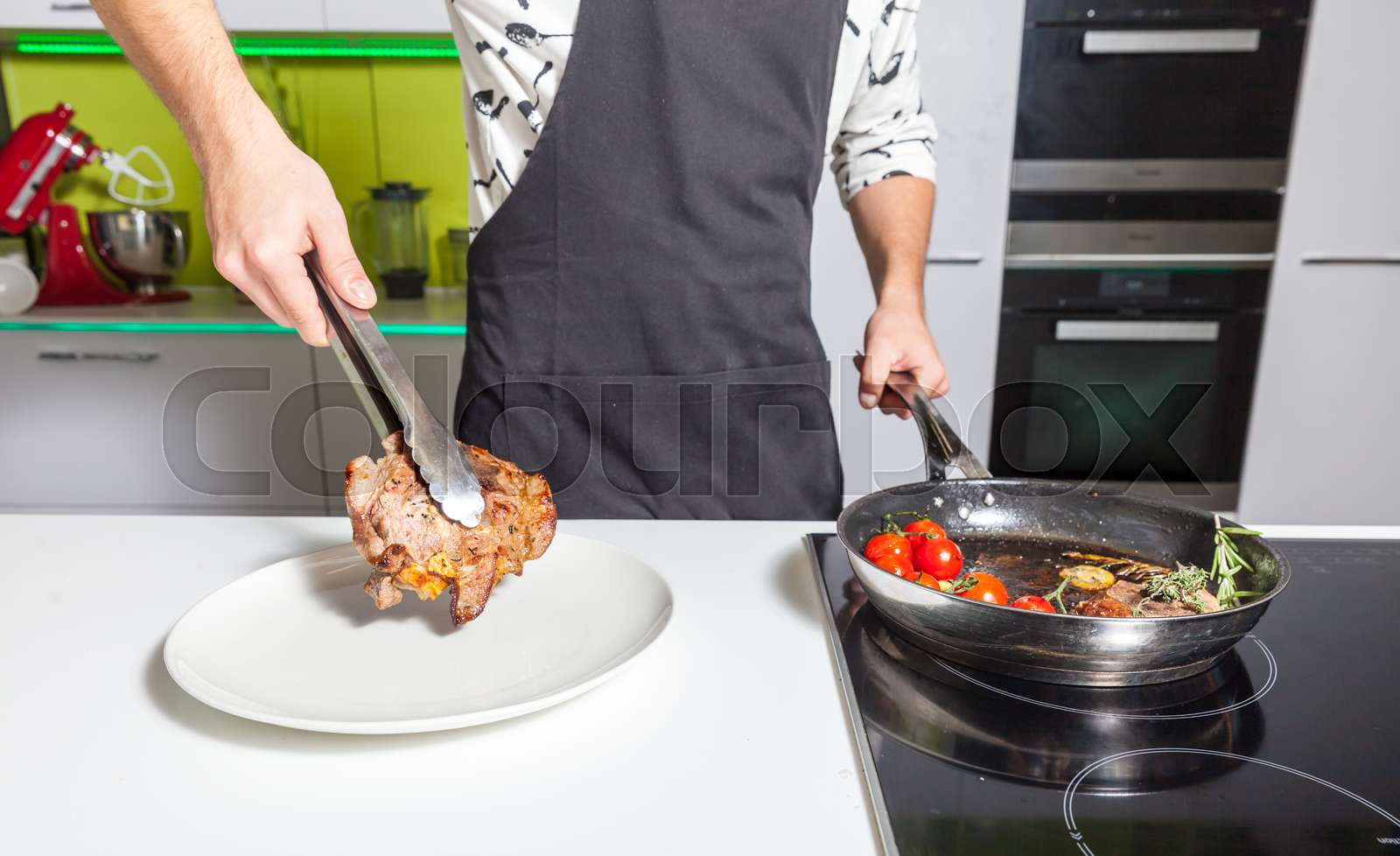 Man cooking at home | Stock image | Colourbox